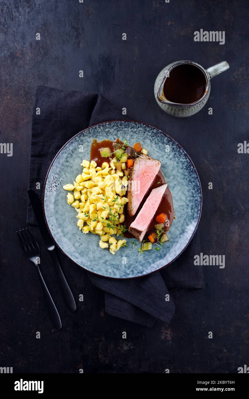 Tafelspitz roast veal slices with Swabian spaetzle and vegetable served ...
