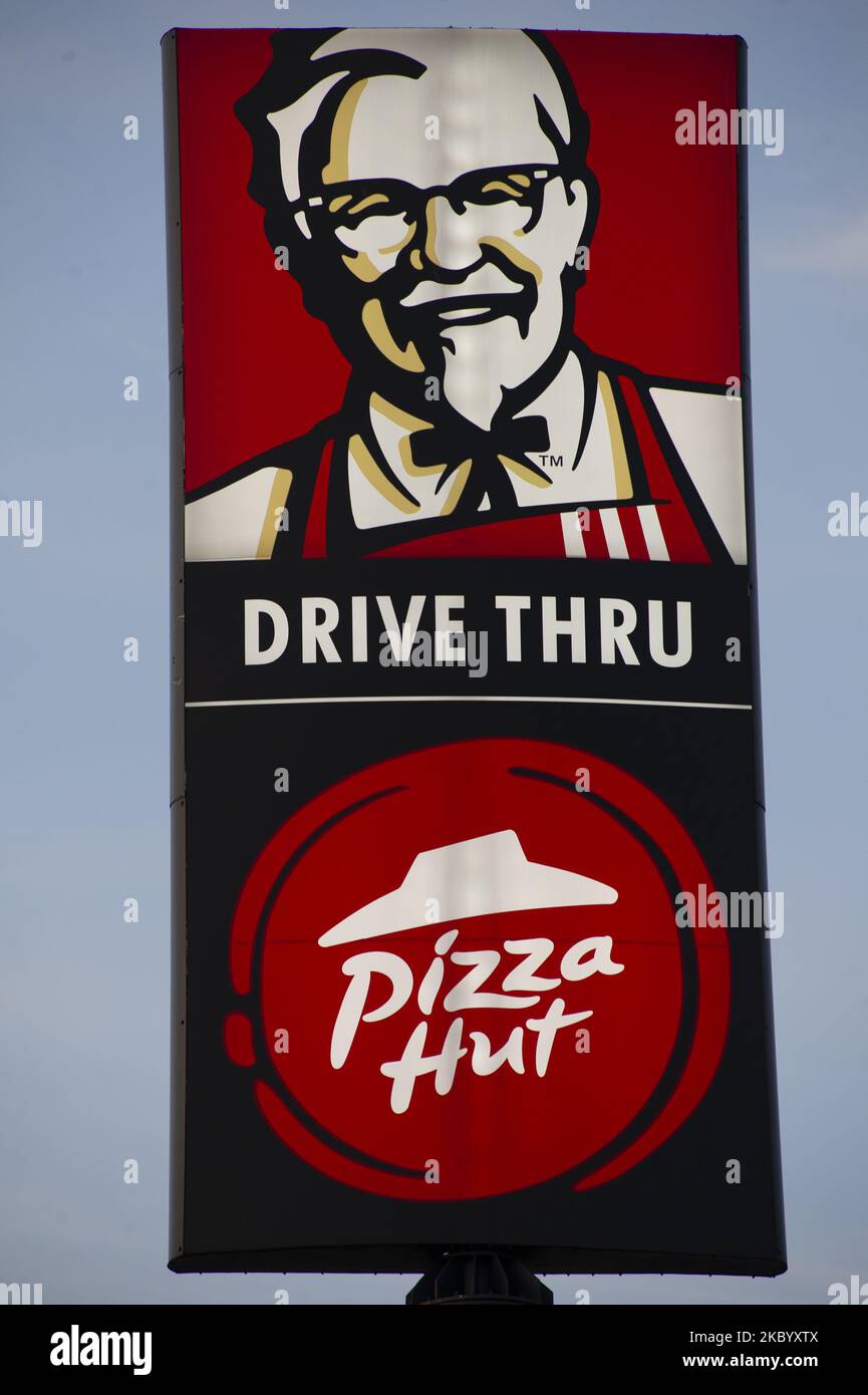 A KFC drive thru and Pizza Hut sign is seen and on September 14, 2020 ...