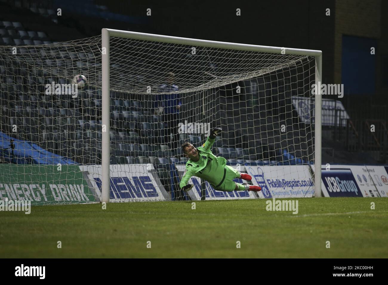 Jack Bonham of Gillingham can not keep out the penalty of Ben Sheaf of ...