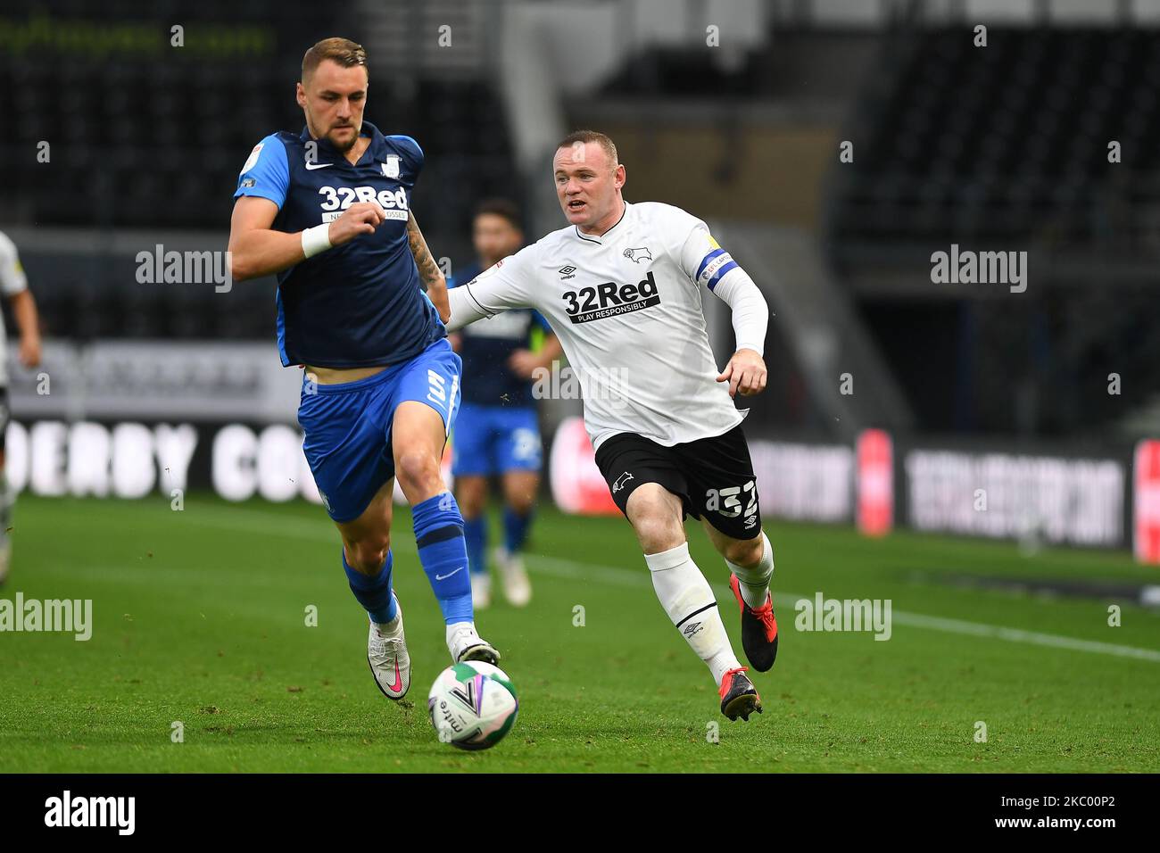 Wayne Rooney of Derby County closes on Patrick Bauer of Preston during ...