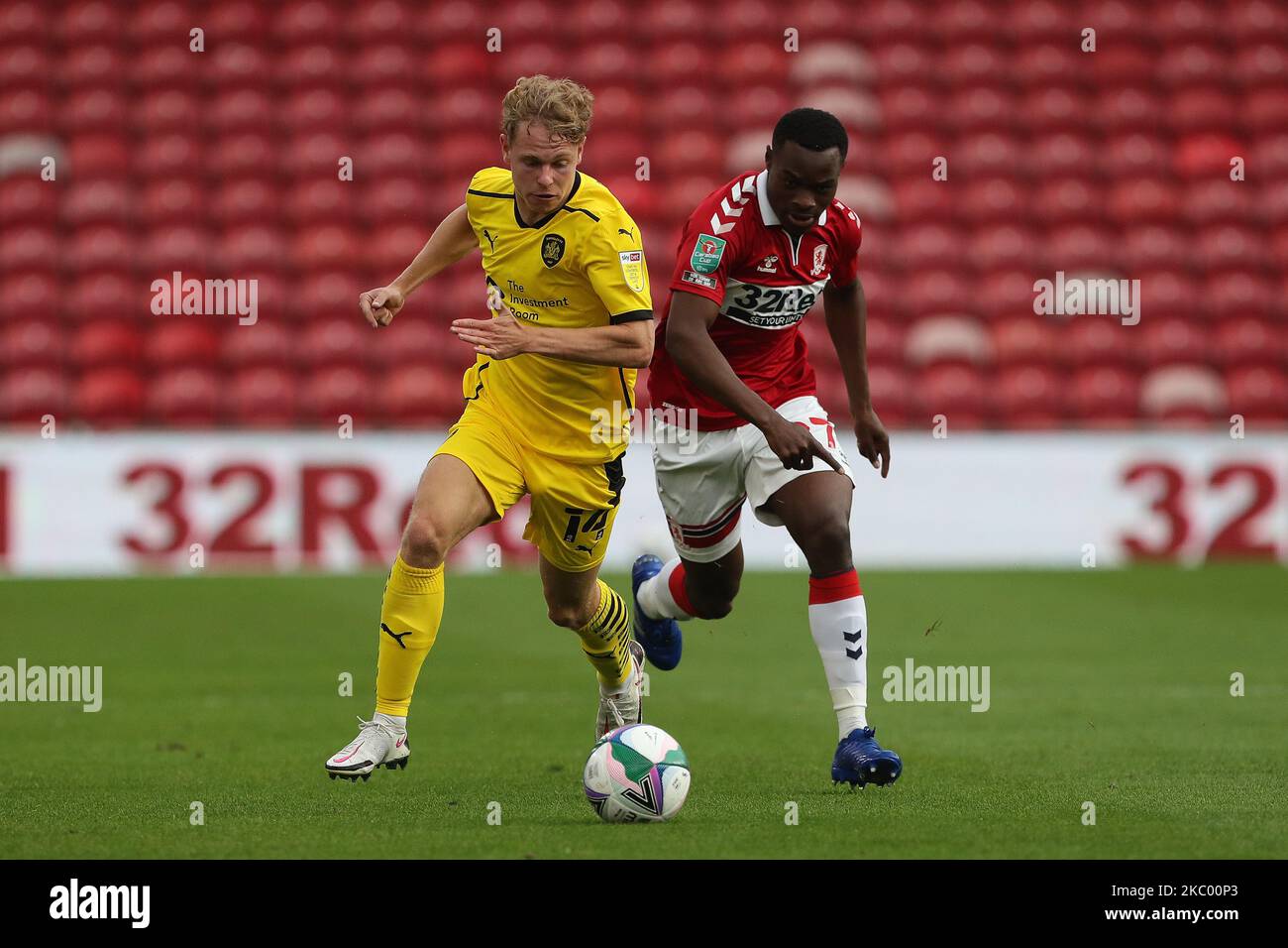 Middlesbrough's Marc Bola in action with Barnsley's Kilian Ludewig ...