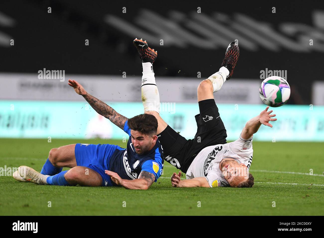 Mike te Wierik of Derby County fouls Sean Maguire of Preston and ...