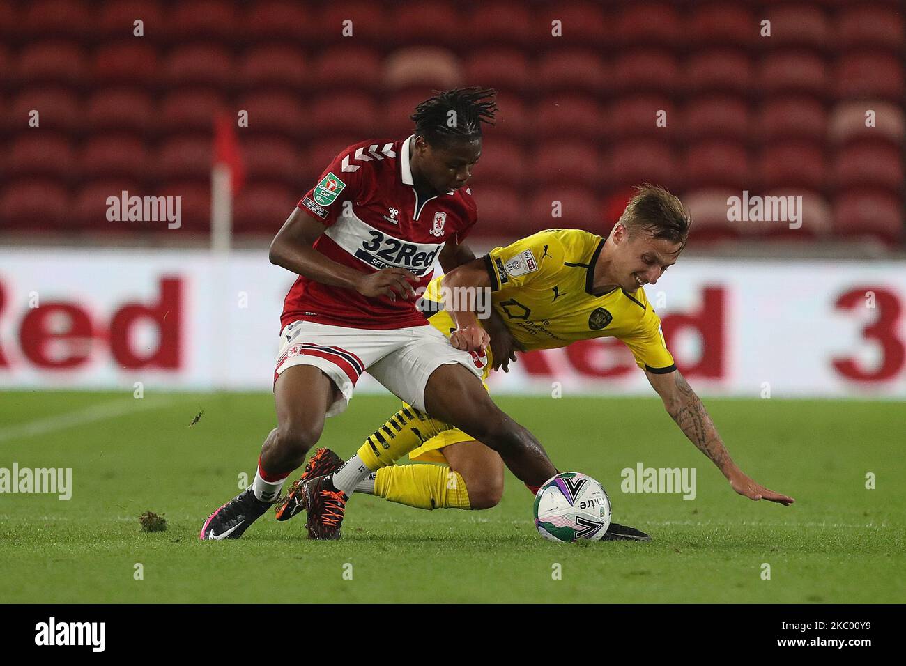 Middlesbrough's Sam Folarin in action dwith Barnsley's Marcel Ritzmaier ...