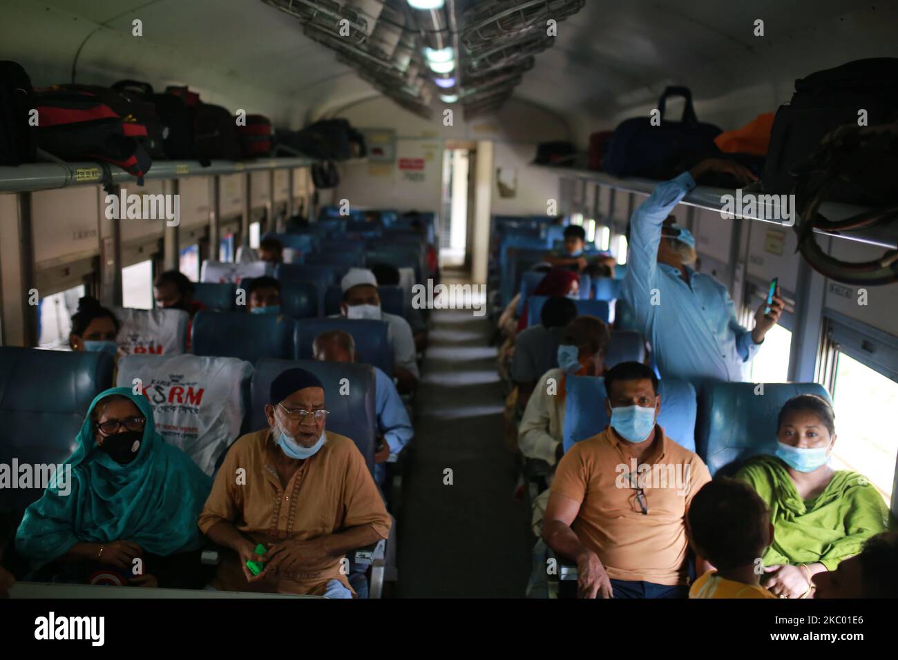 Passengers boarded a train after Bangladesh Railway authority resume ...