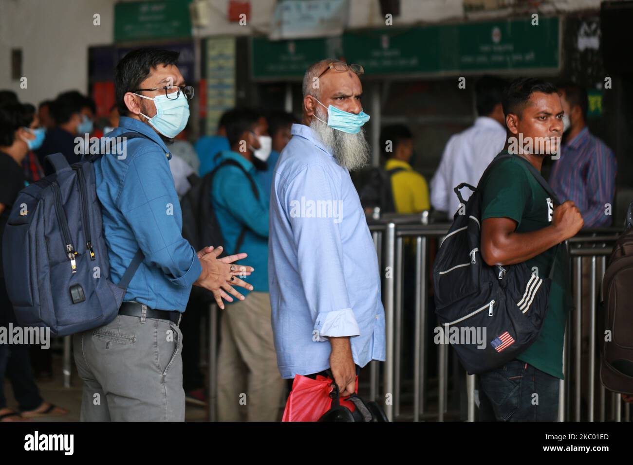 Passenger in a queue to buy tickets at a railway station after Bangladesh Railway authority ...