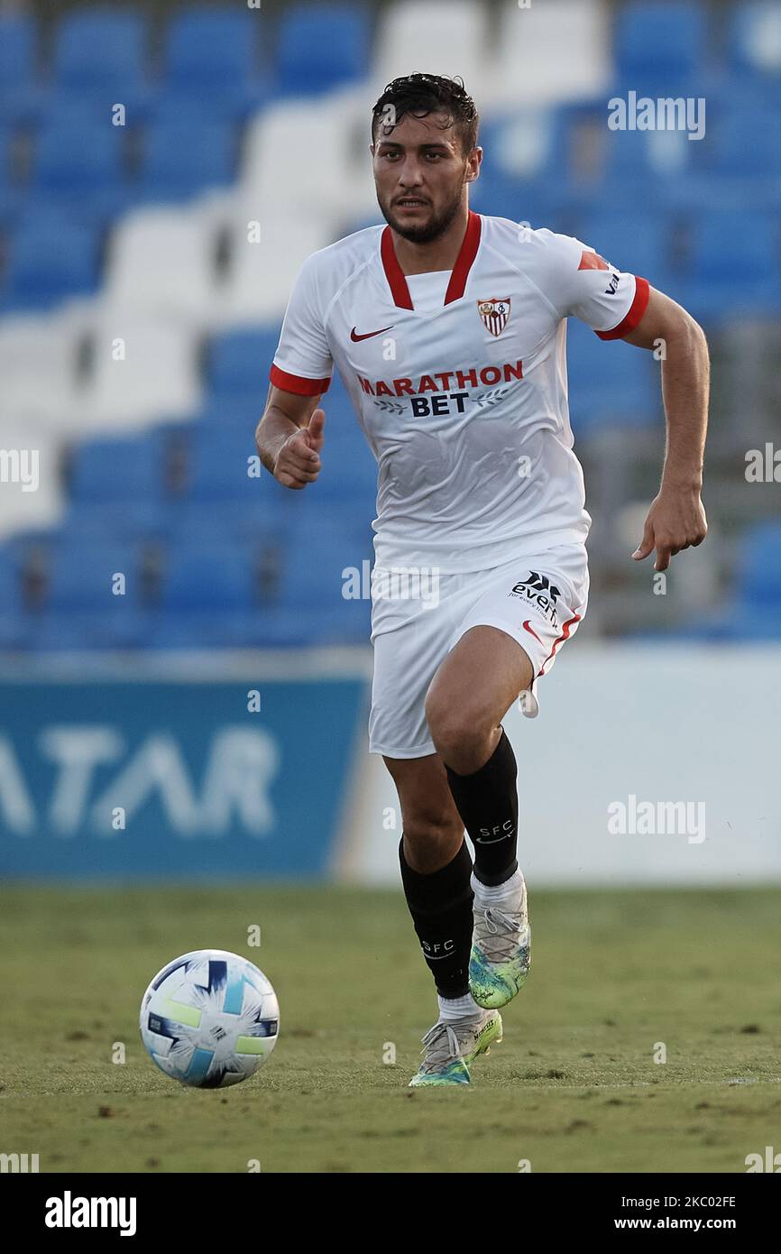 Oscar Rodriguez of Sevilla runs with the ball during the pre-season ...