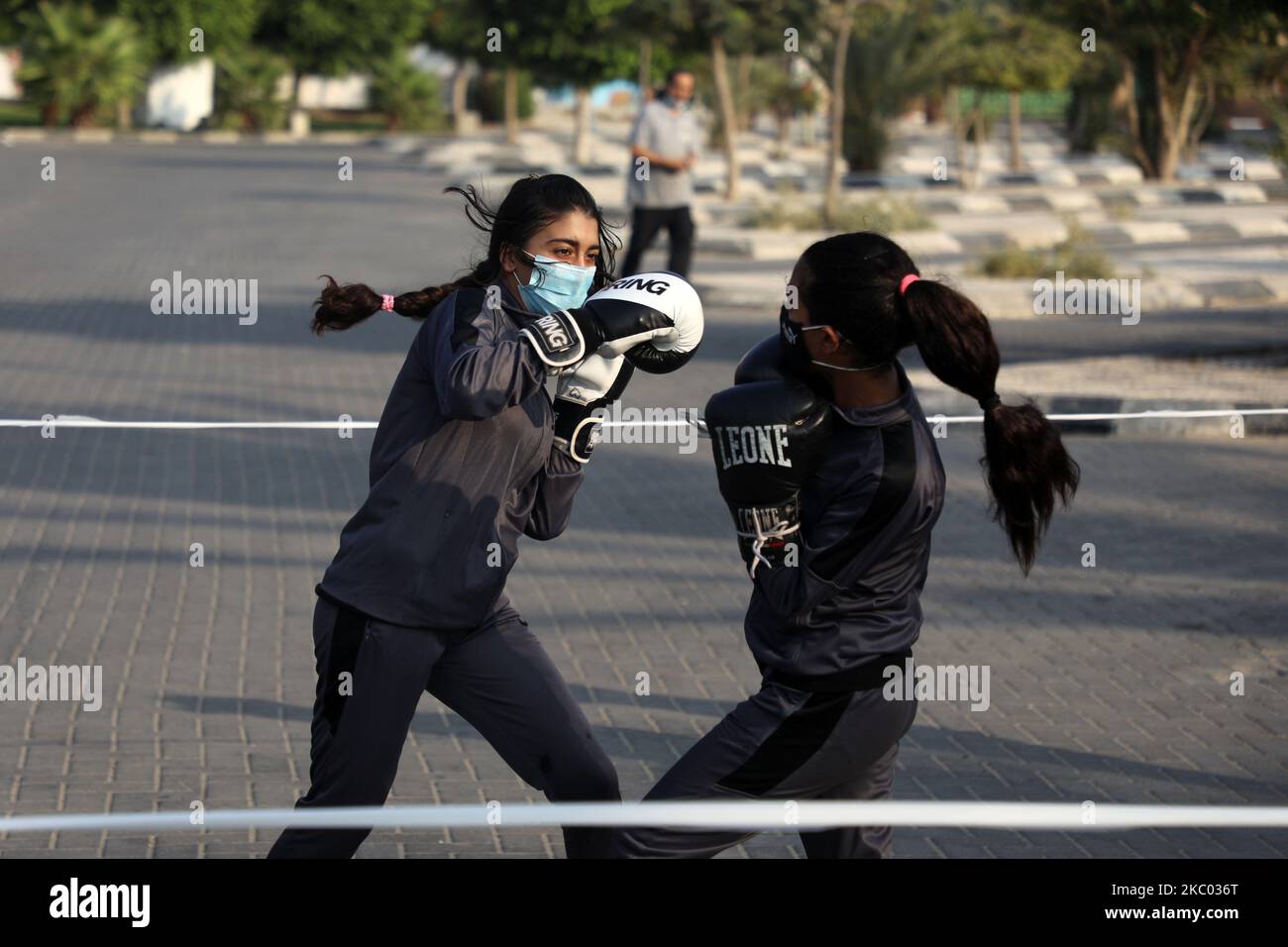 Palestinian girls clad in masks due to the COVID-19 coronavirus ...