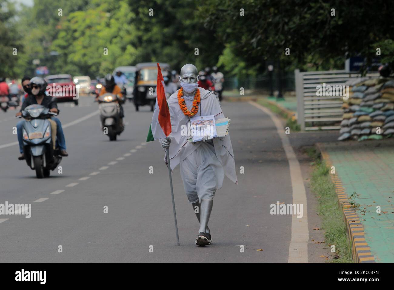 A social worker dressed as like as father of nation Mahatma Gandhi as ...