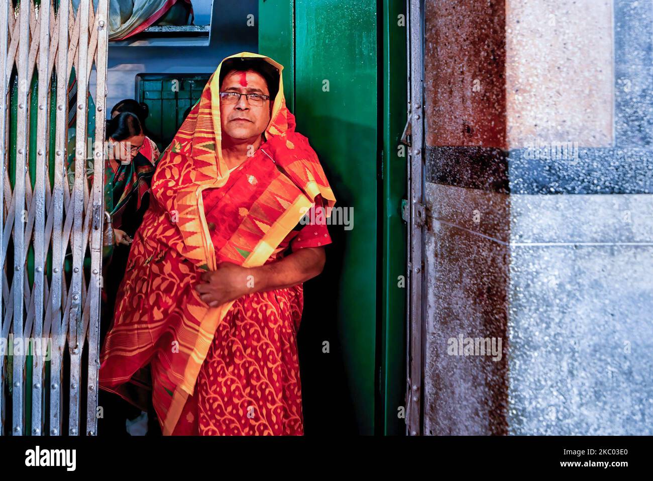 A Hindu man seen dressed up as a woman (saree) during jagadhatri puja ...