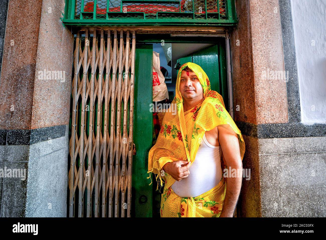 A Hindu man seen dressed up as a woman (saree) during jagadhatri puja ...