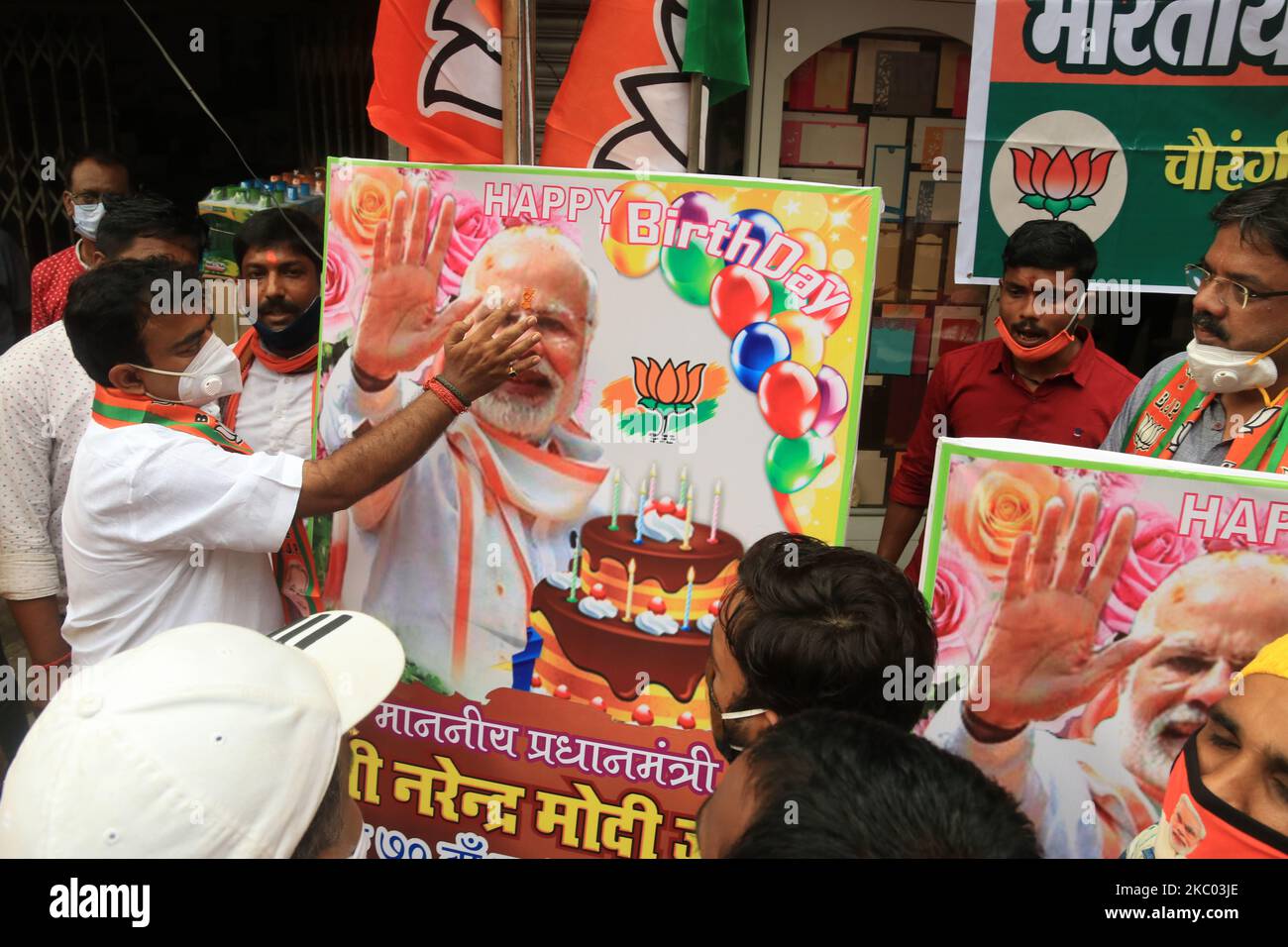 Supporter of India's Bharatiya Janata Party (BJP) distribute sweet ...
