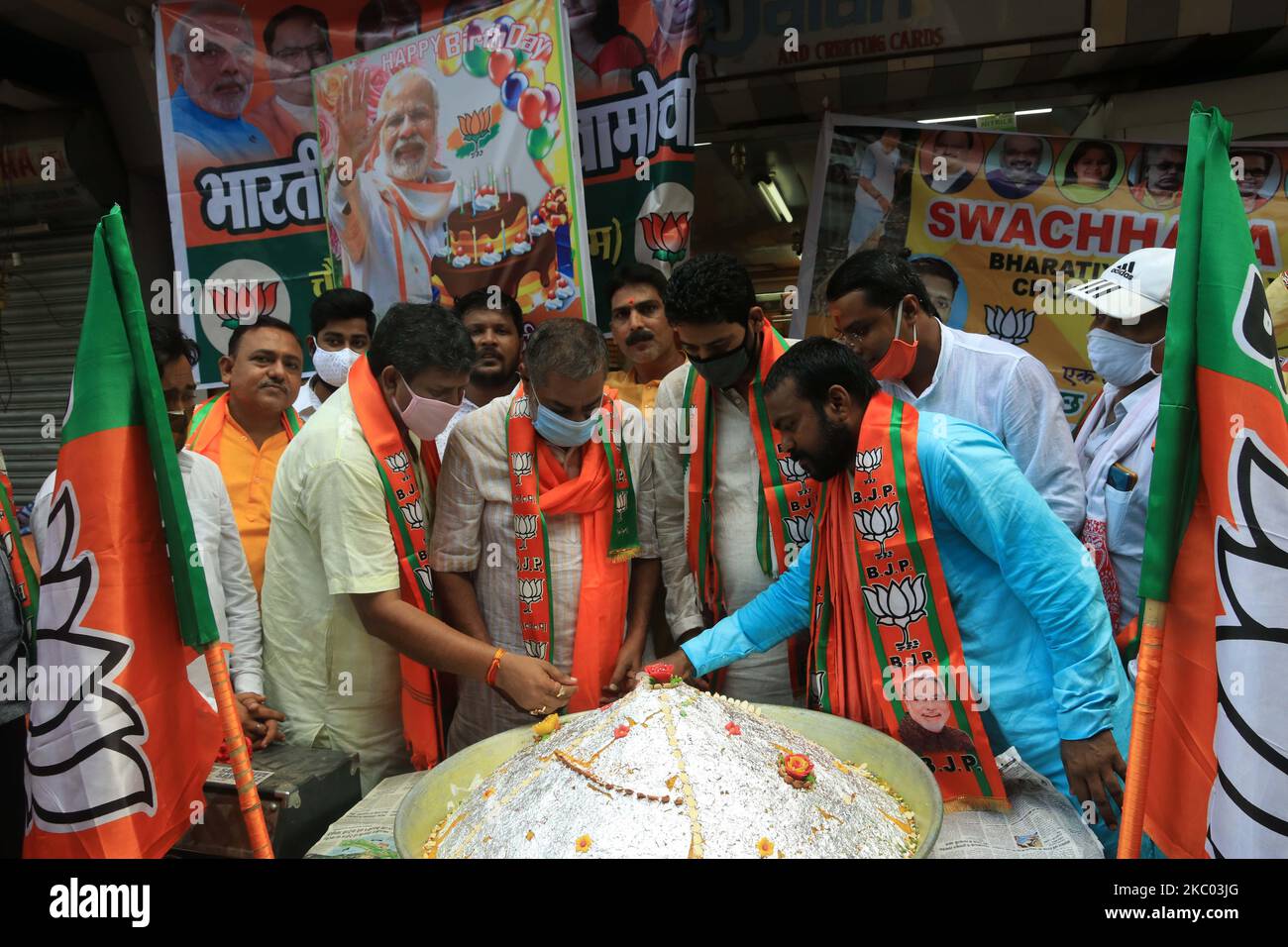 Supporter of India's Bharatiya Janata Party (BJP) distribute sweet ...