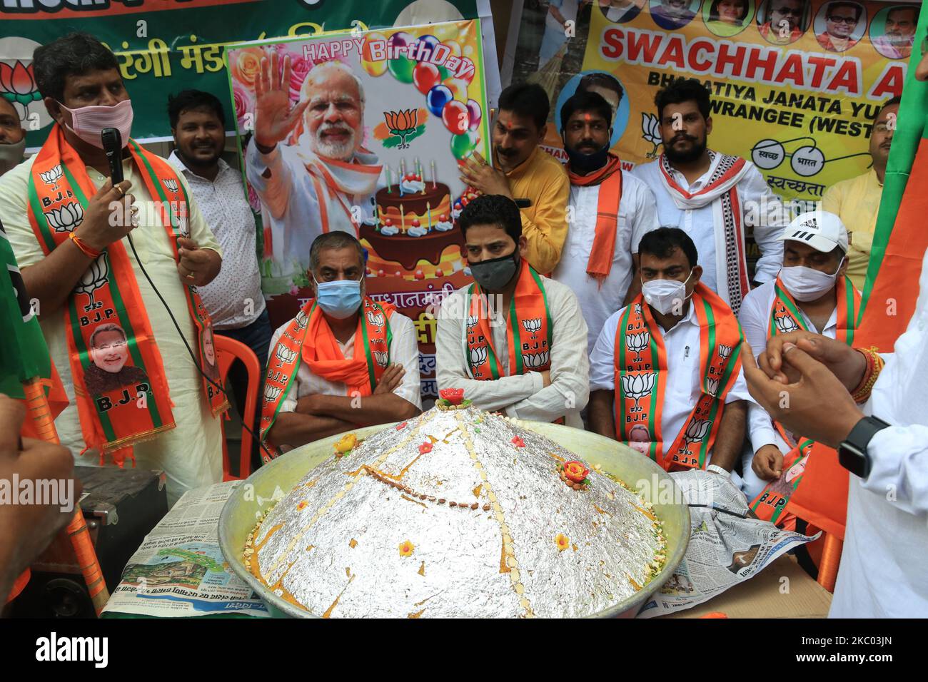 Supporter of India's Bharatiya Janata Party (BJP) distribute sweet ...