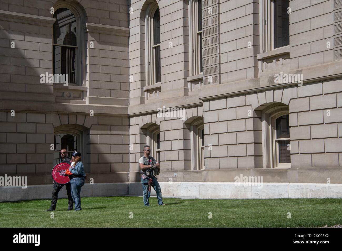 Members of the Michigan Liberty Militia take a step away from the ...