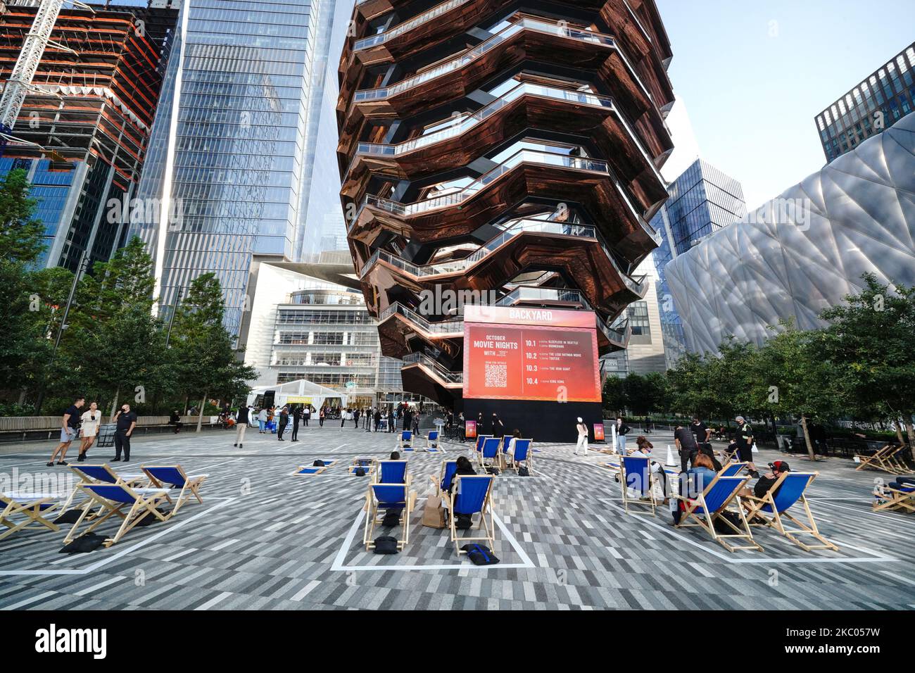 A view of people enjoying the Hudson Yards’ Backyard Big Screen curated ...