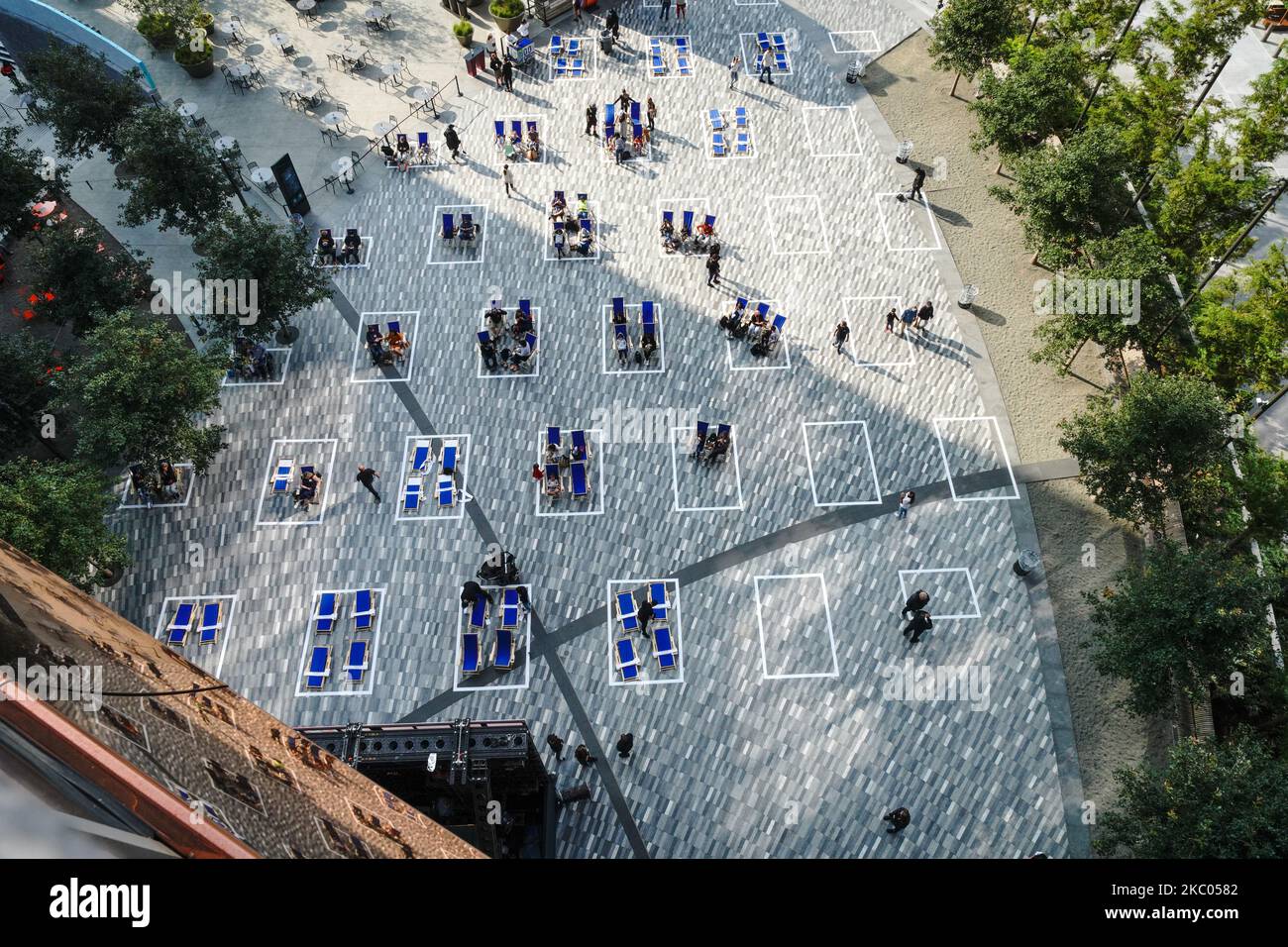 A view of people enjoying the Hudson Yards’ Backyard Big Screen curated ...