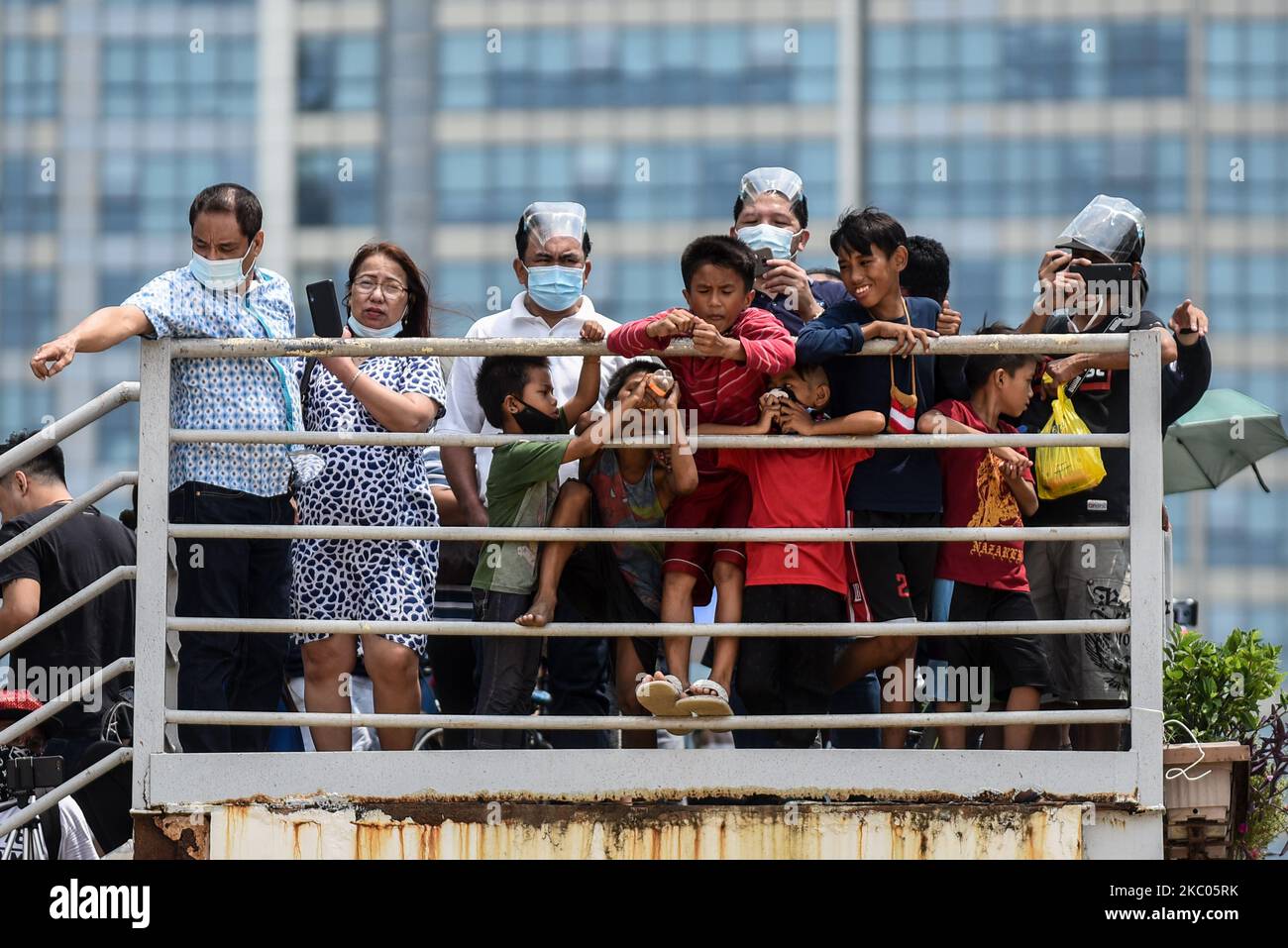 People flock to an overpass overlooking the rehabilitated portion of ...