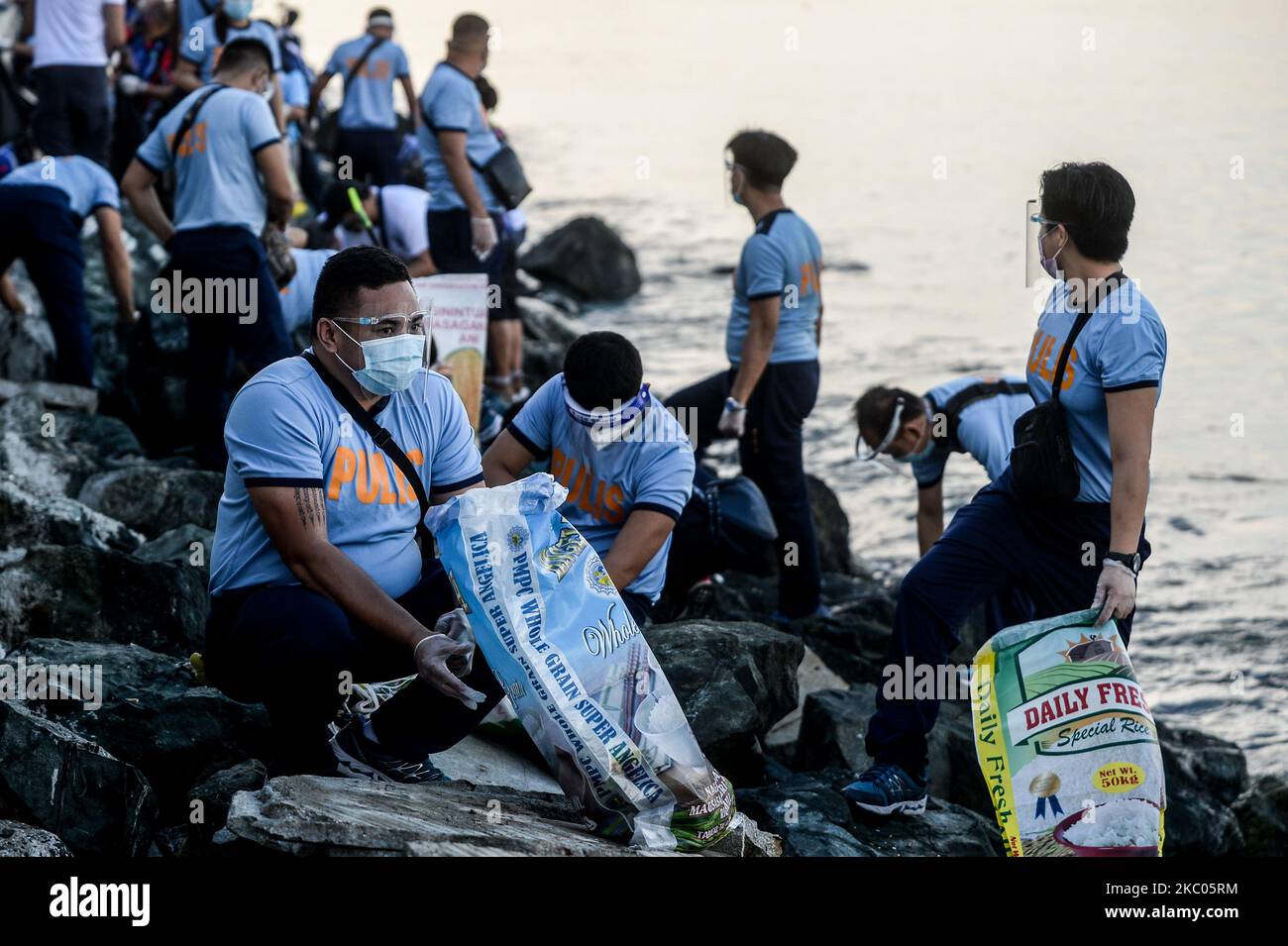 Police officers clean a portion of Manila Bay in celebration of ...