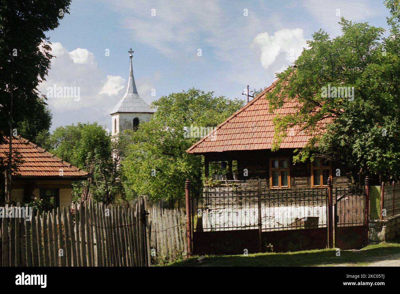 Hunedoara County, Romania, approx. 2001. Houses and Christian Orthodox ...