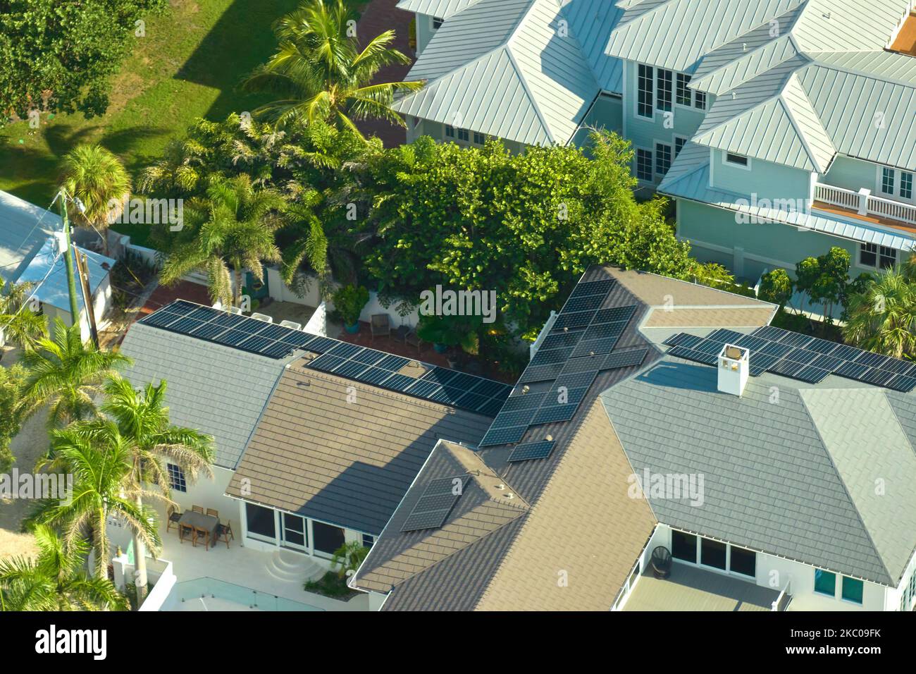 Aerial view of new expensive american building roof with rows of blue ...
