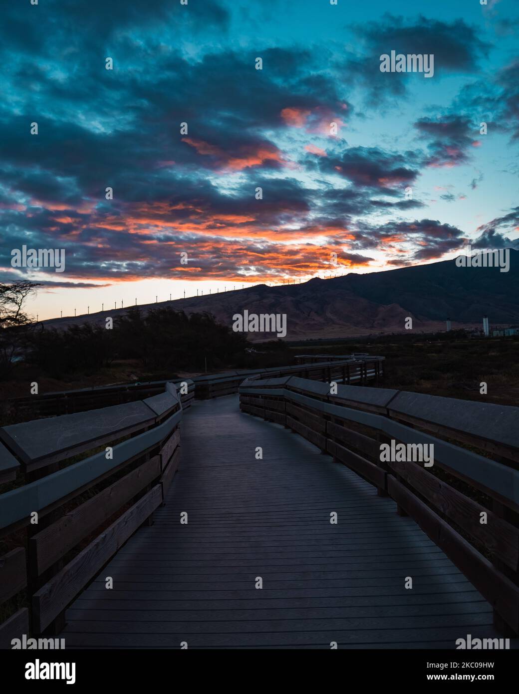 A vertical shot of Kealia Coastal Boardwalk at sunset with a dramatic ...