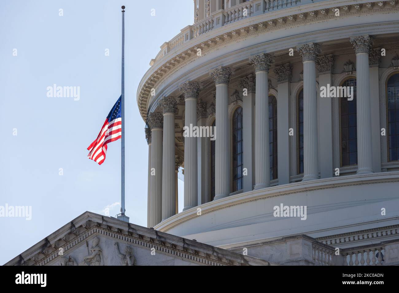 The American flag above the US Capitol Building is seen at half staff ...