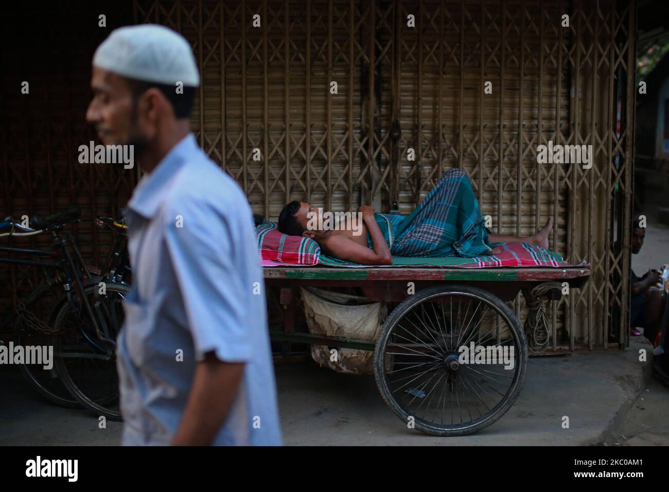 A man sleep on his van in Dhaka, Bangladesh on September 21, 2020. Many ...