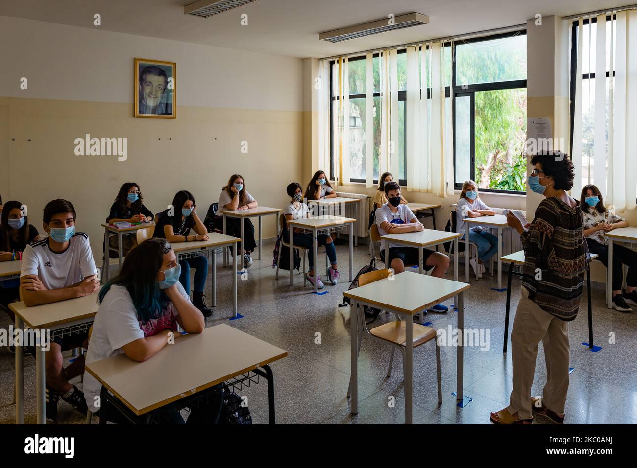 Students inside the classroom, begin their first lesson on the first ...