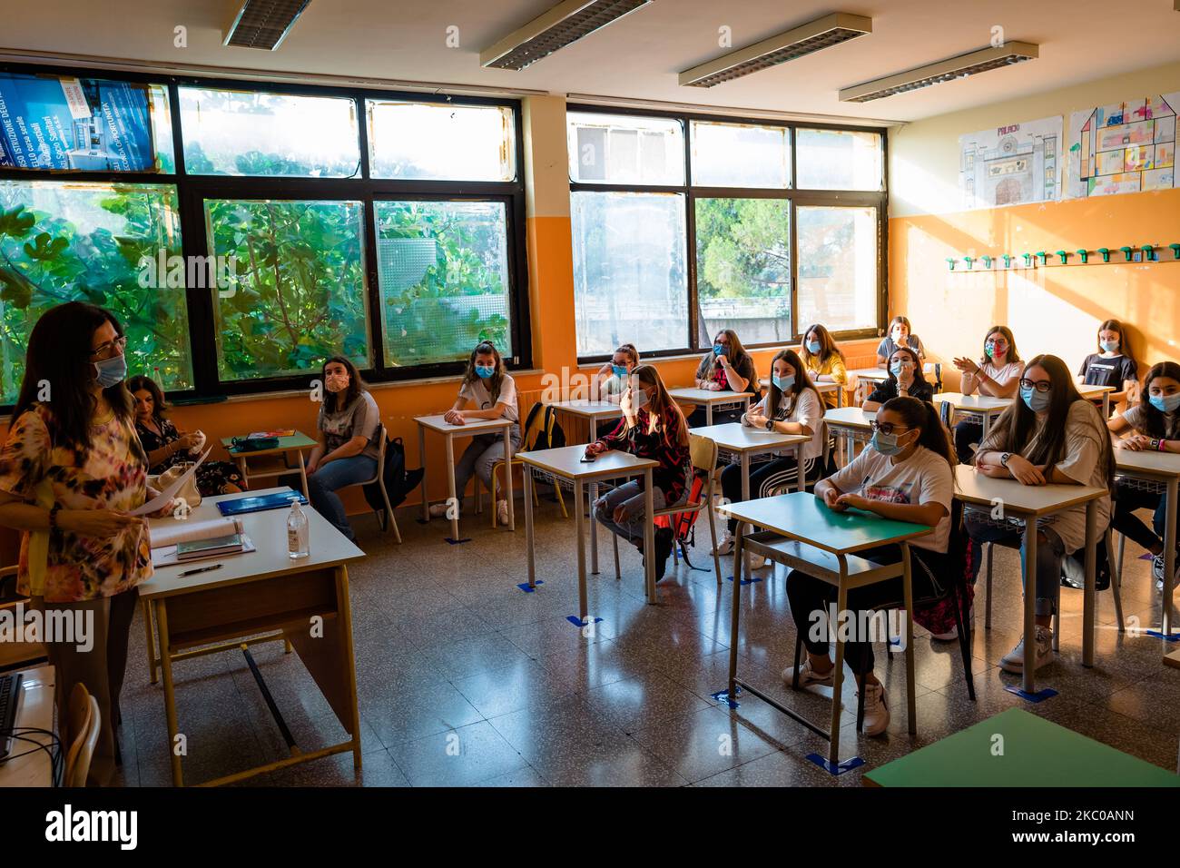 Students inside the classroom, begin their first lesson on the first ...