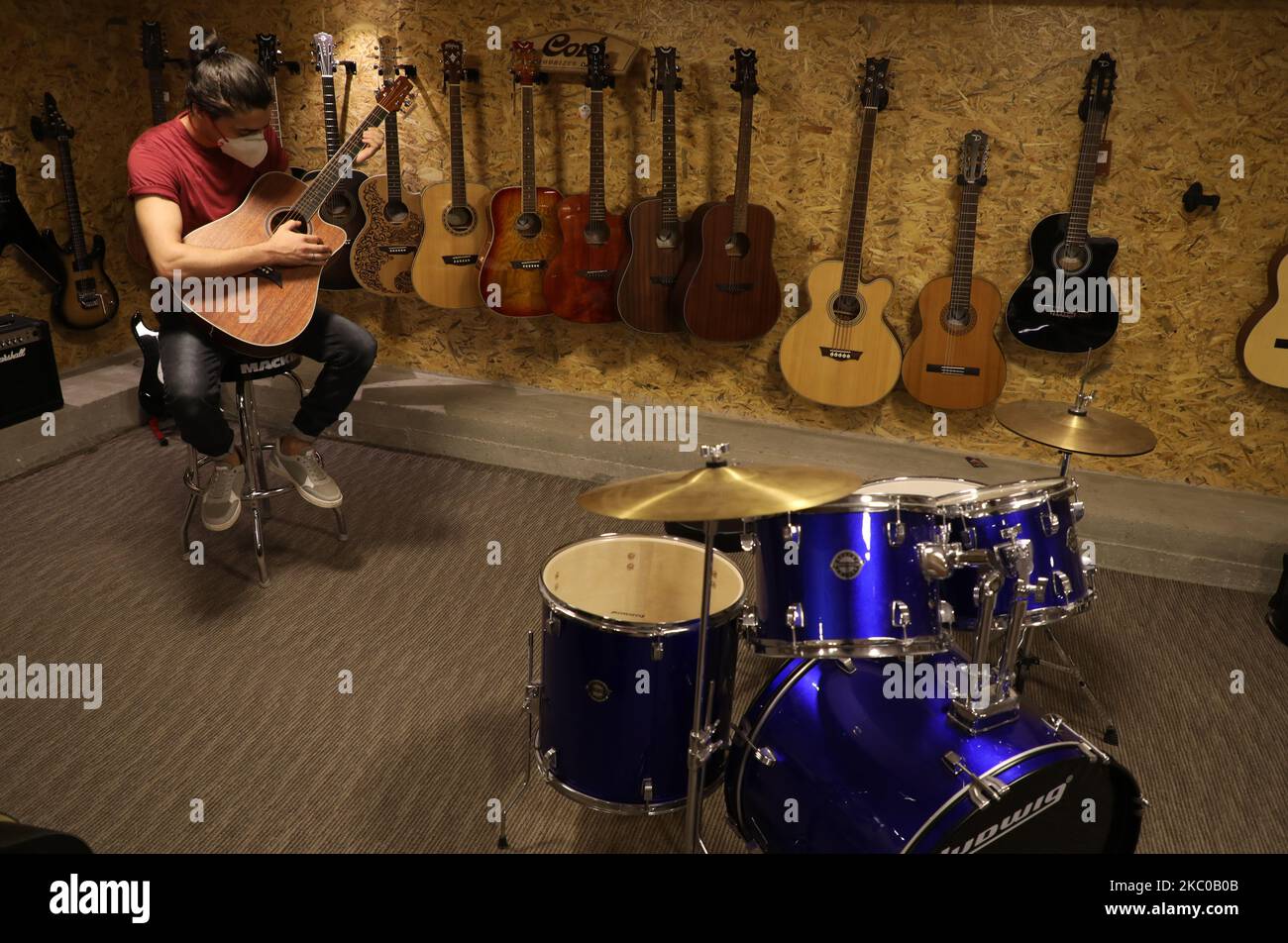 A Palestinian journalist is testing musical instruments in the JARU ...