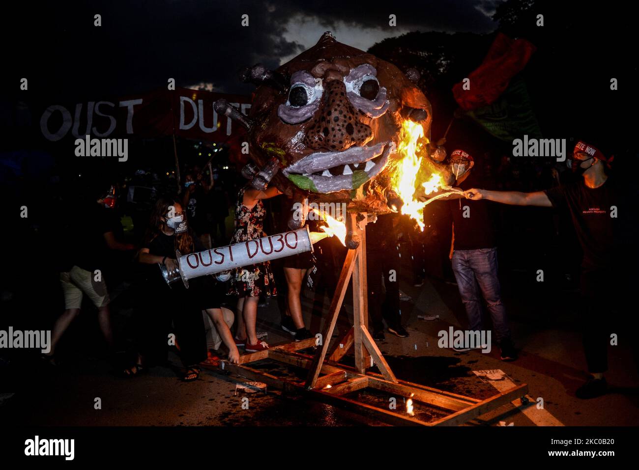 Activists burn an effigy portraying Philippine President Rodrigo ...