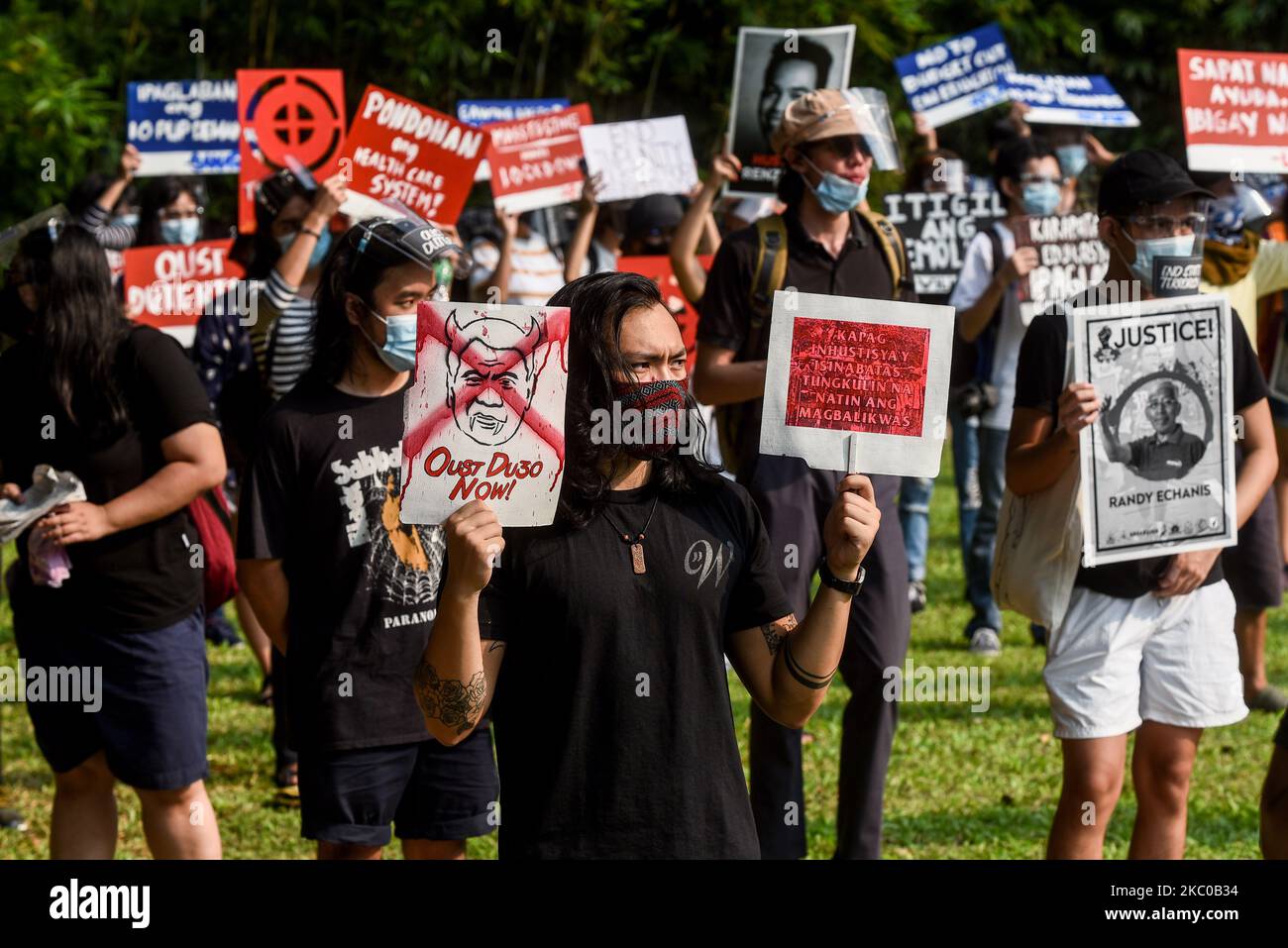 Activists carrying signs join a protest during the 48th anniversary of ...