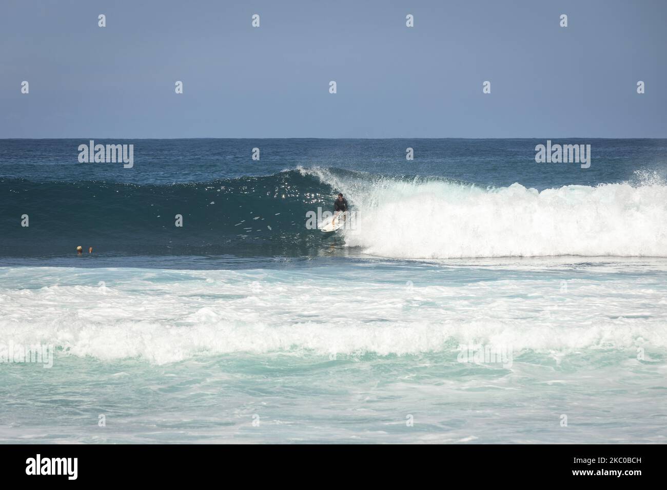People practice surf in Isabela, Puerto Rico, on September 20, 2020 ...