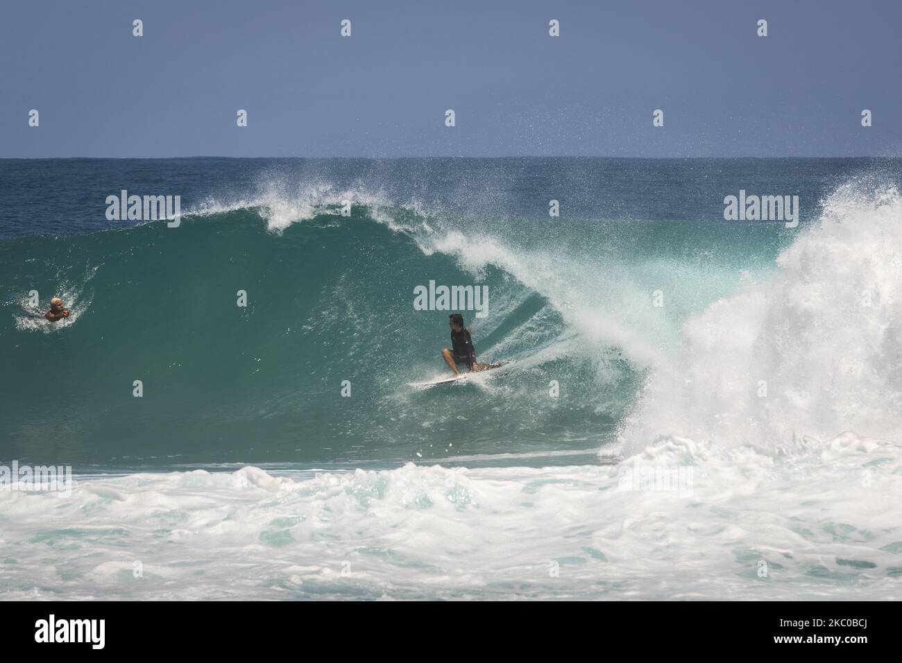 People practice surf in Isabela, Puerto Rico, on September 20, 2020 ...
