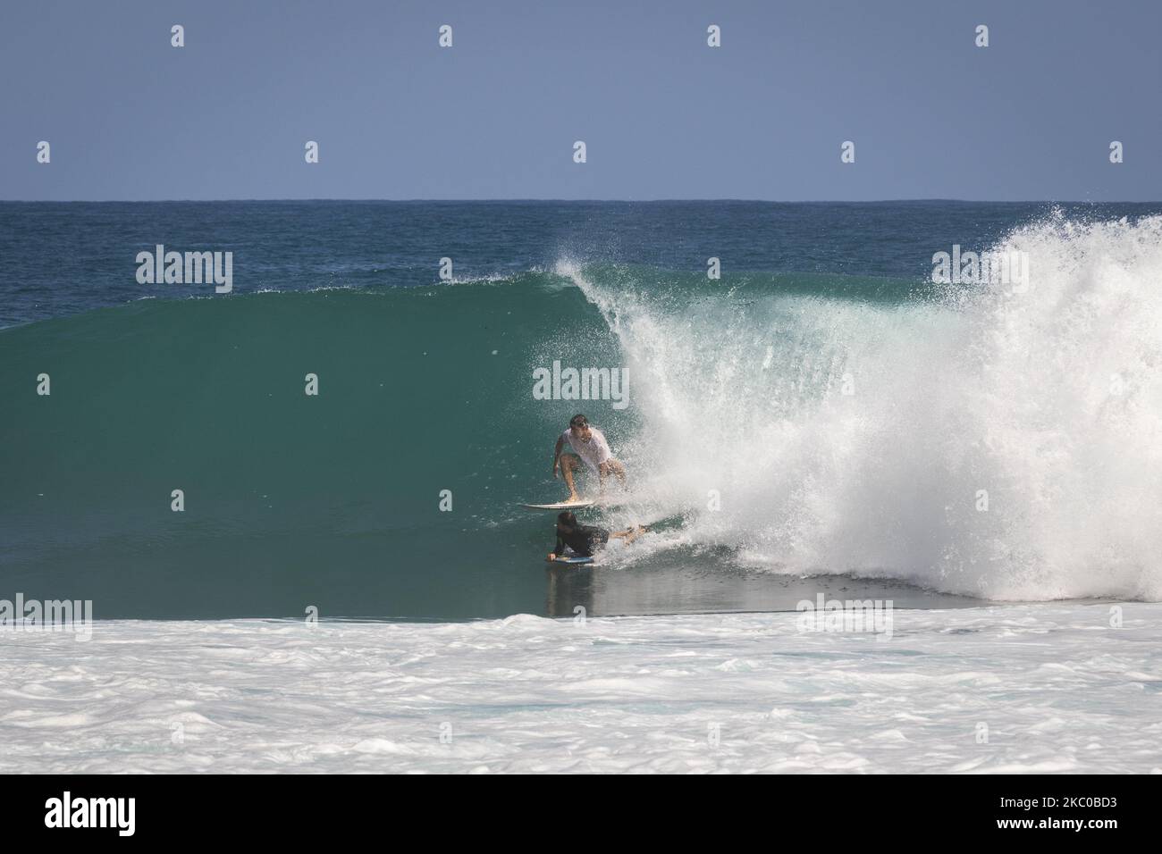 People practice surf in Isabela, Puerto Rico, on September 20, 2020 ...