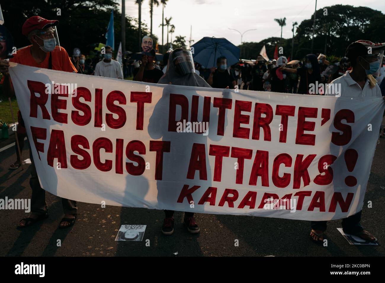 Activists stage a protest at the UP Diliman in Quezon City on September ...