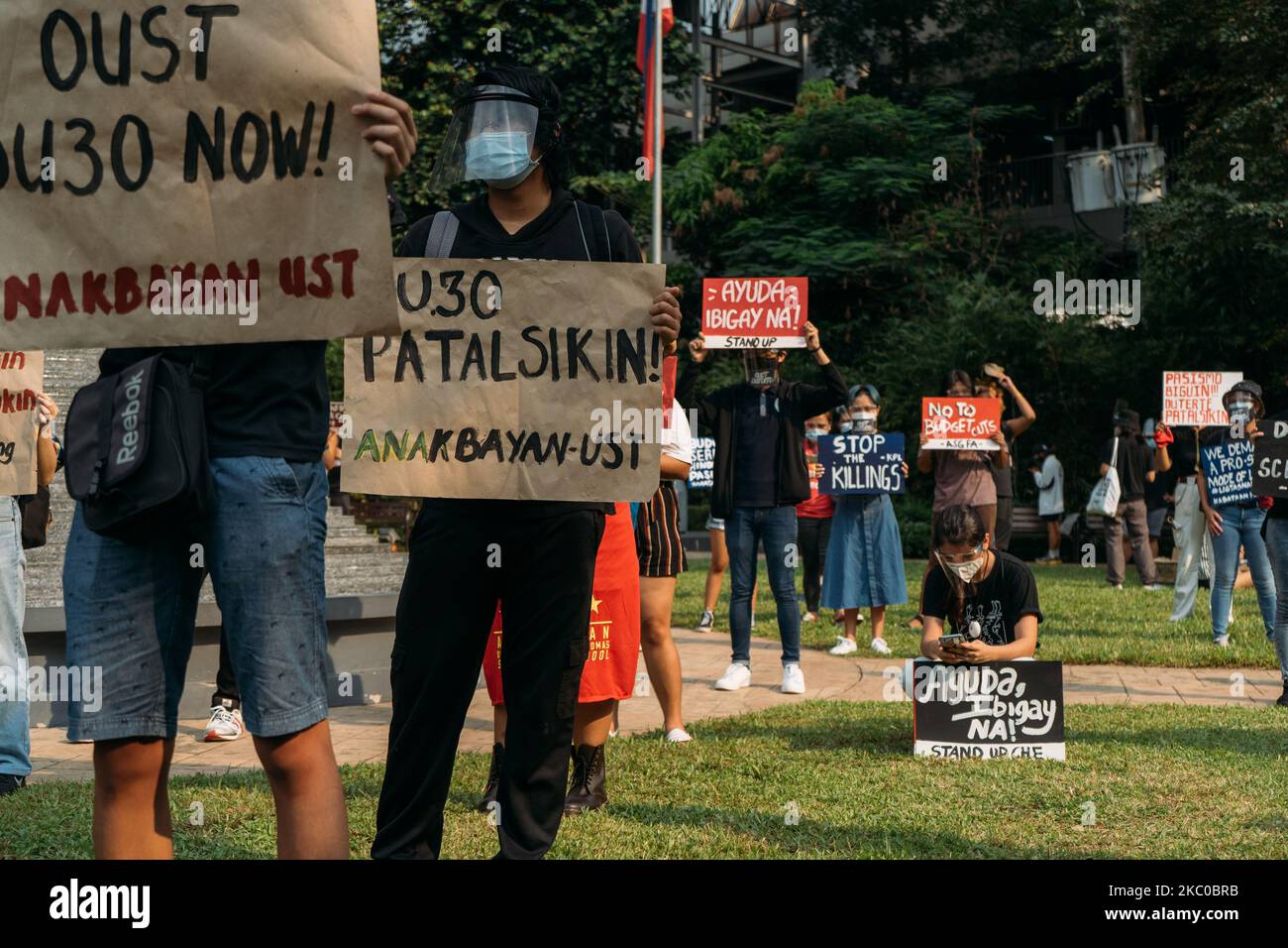 Protesters hold placards during the demonstration. Hundreds of Youth ...