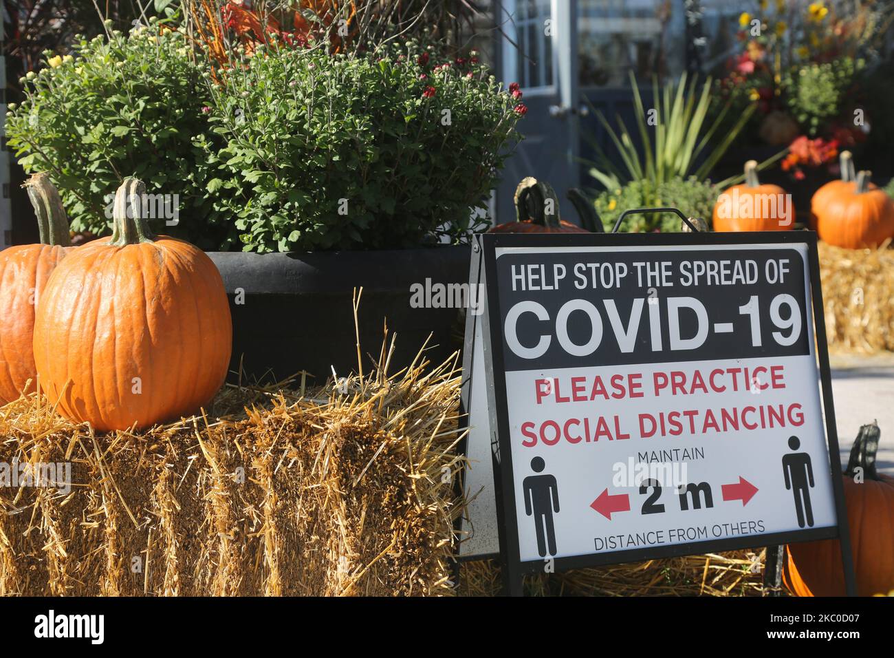 Sign urging social distancing (physical distancing) by an Autumn ...