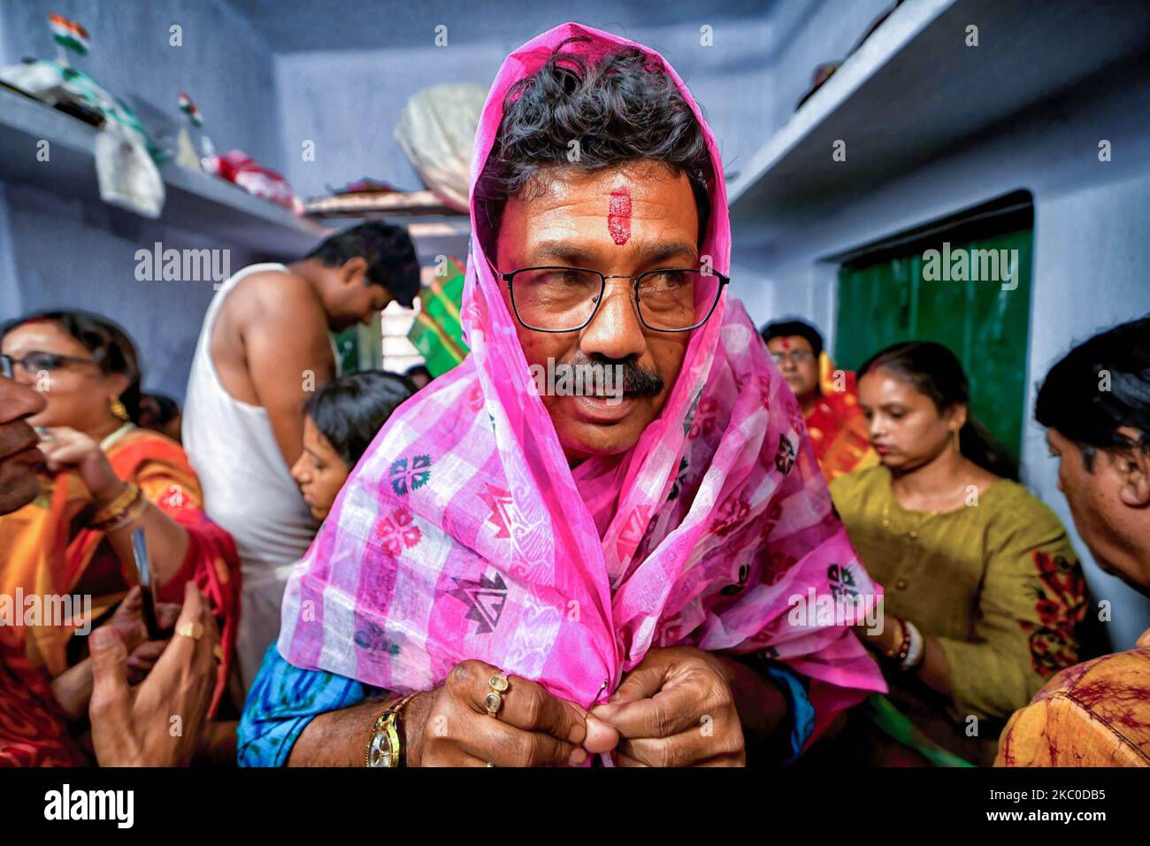 A Hindu man seen dressed up as a woman (saree) during jagadhatri puja ...