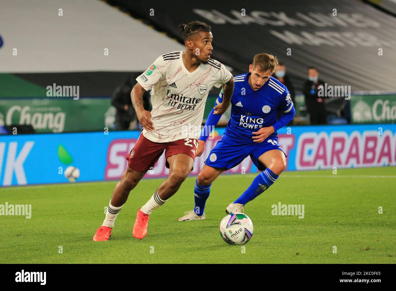 Reiss Nelson of Arsenal and Marc Albrighton of Leicester City during ...