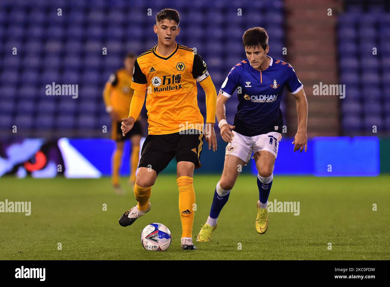 Oldham's Bobby Grant and Wolves Christian Marques in action during the ...