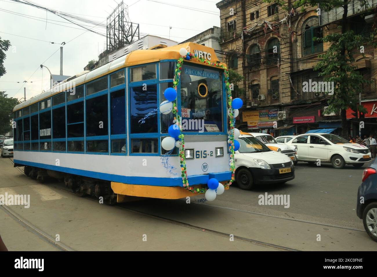 Newly launched tram library operates as vehicles on a road ,in Kolkata ...