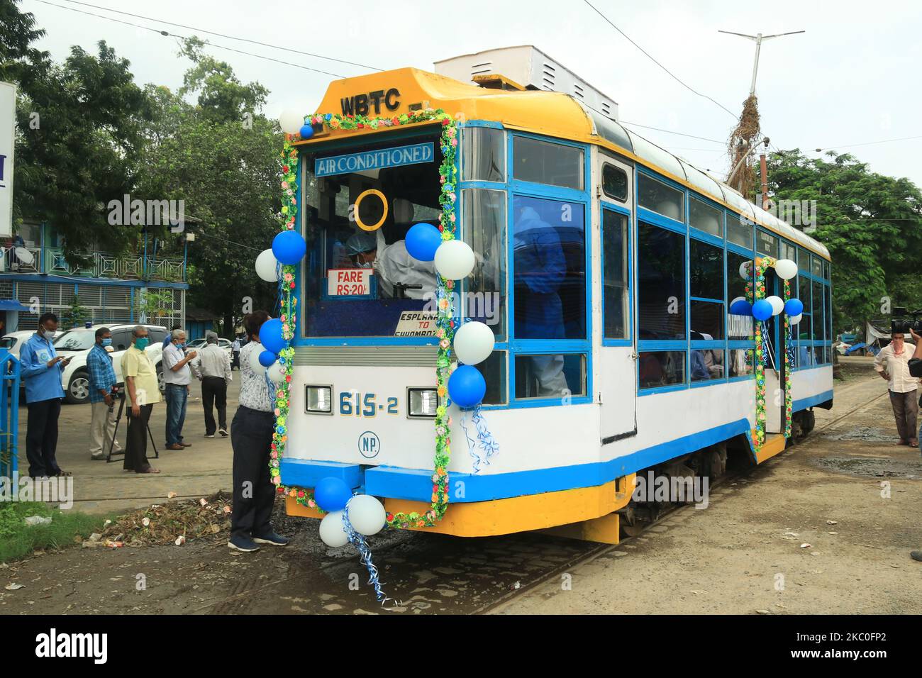 Newly launched tram library operates as vehicles on a road ,in Kolkata ...