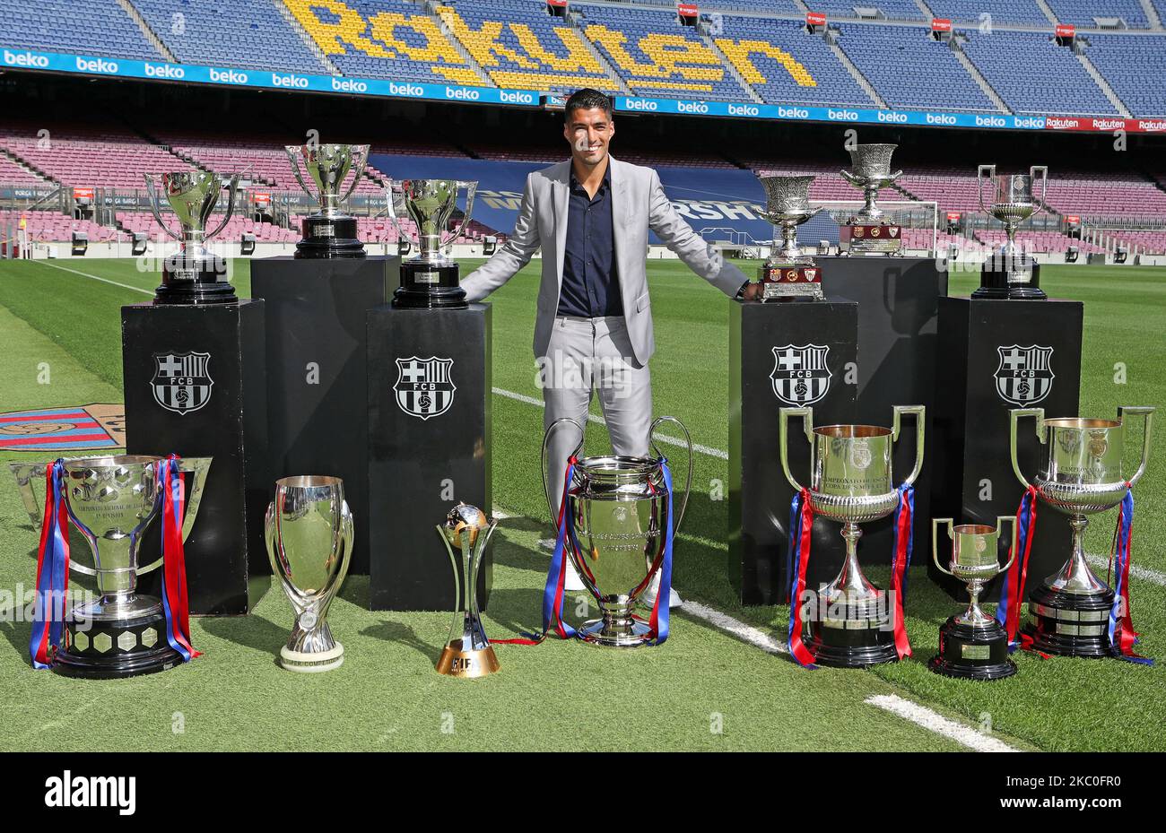Luis Suarez at the Camp Nou stadium with all the trophies he has won ...