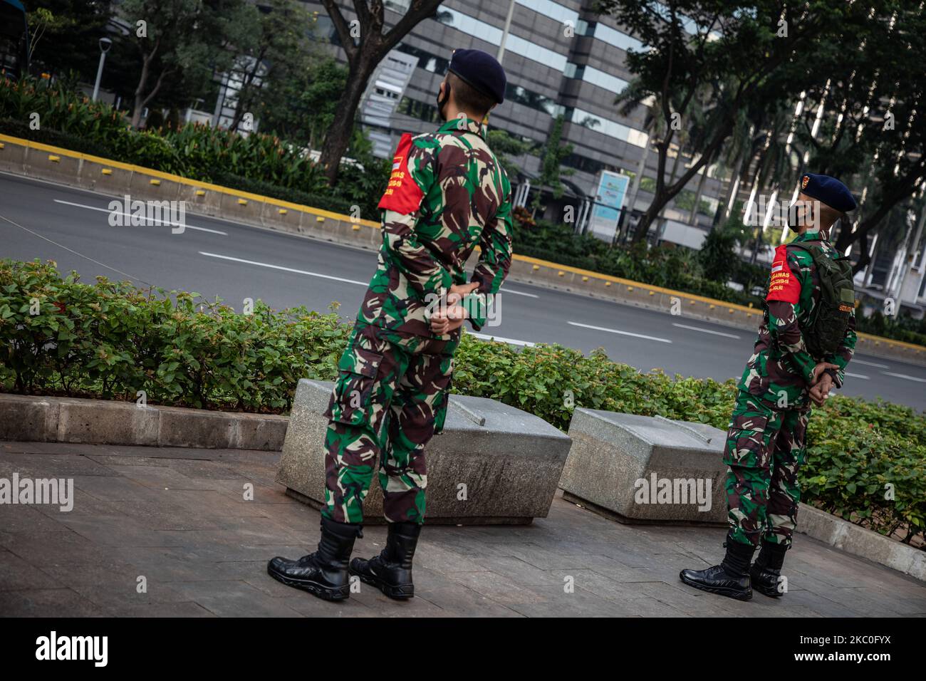 Millitary personnel while guarding street sudirman during partial lock ...