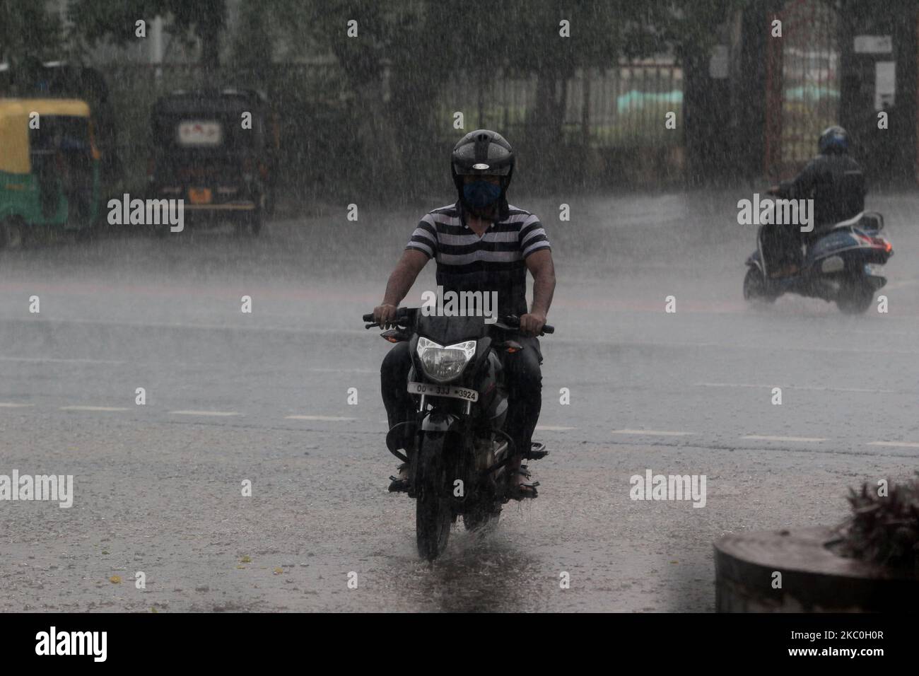 Depression rain cloud looming in the sky before downpour as commuter ...