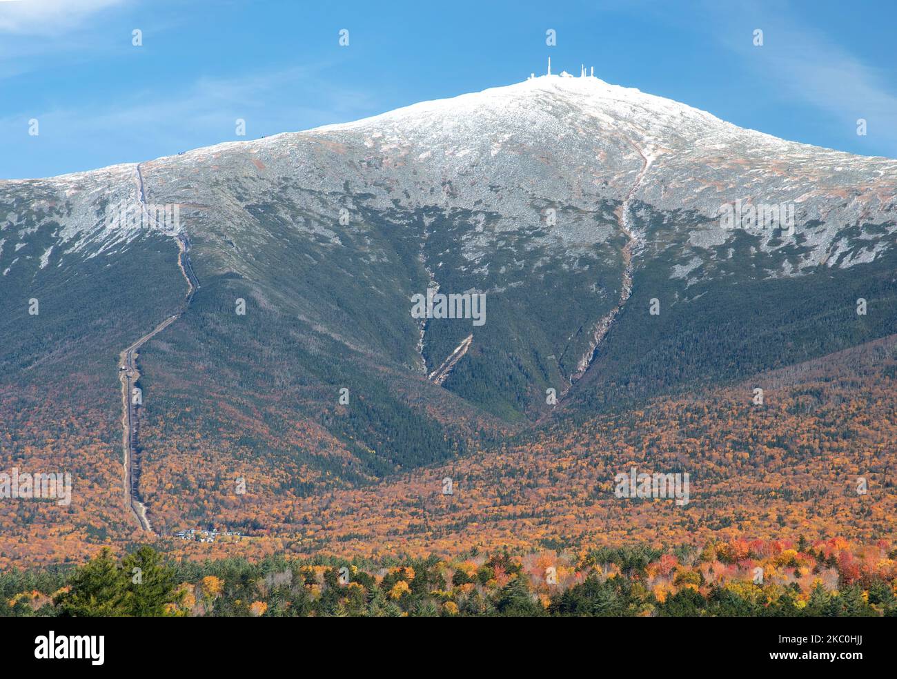 Blue sky and colorful fall foliage with snow atop Mount Washington in ...