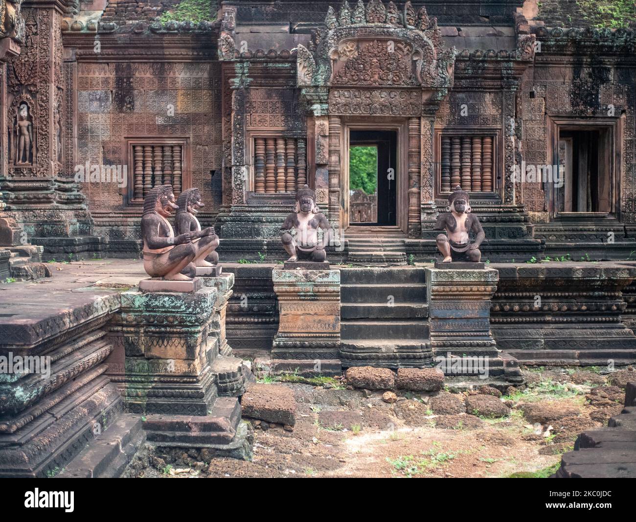 The monkey statues in the ruin of historical Angkor Wat in the woods ...