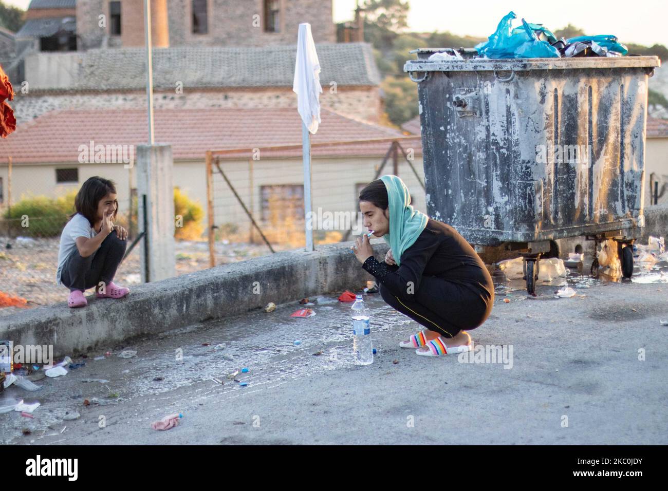 Refugee girl sleeping on street hi-res stock photography and images - Alamy