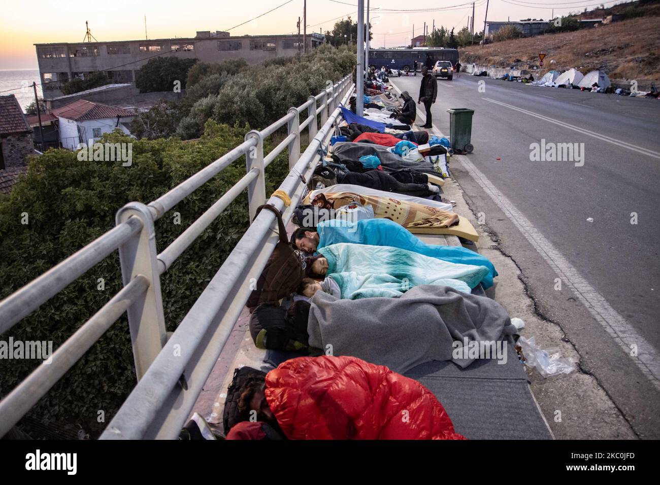 Refugee girl sleeping on street hi-res stock photography and images - Alamy